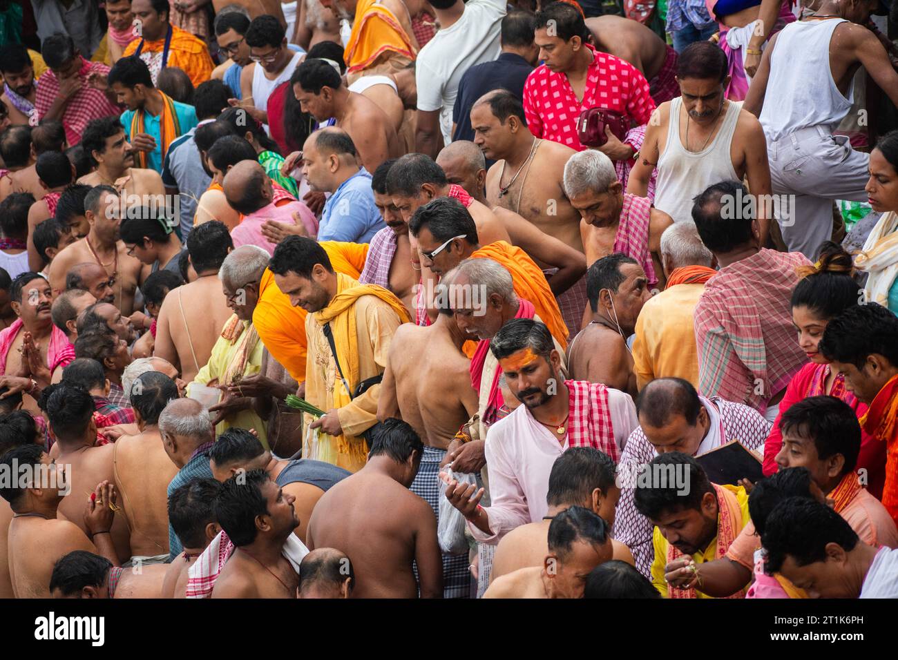 Hindu devotees perform the 'Tarpan' ritual during Mahalaya prayers ...