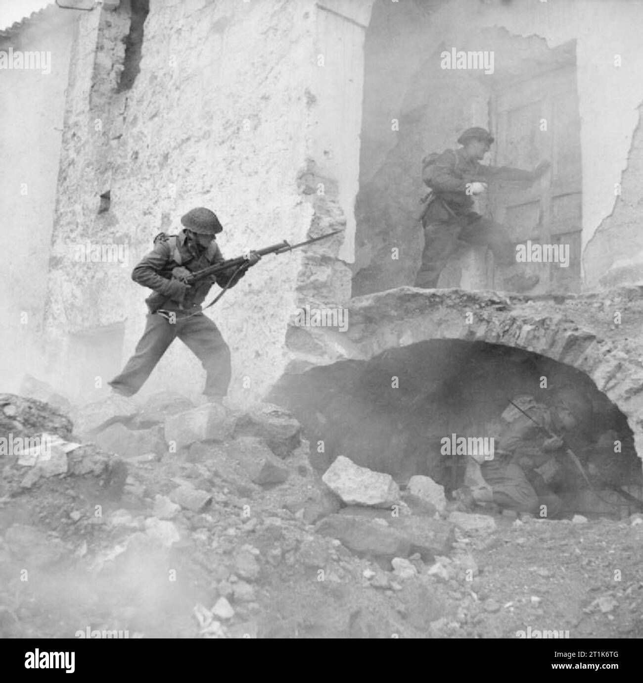 Staged reconstruction of infantry clearing buildings in Cassino, Italy ...