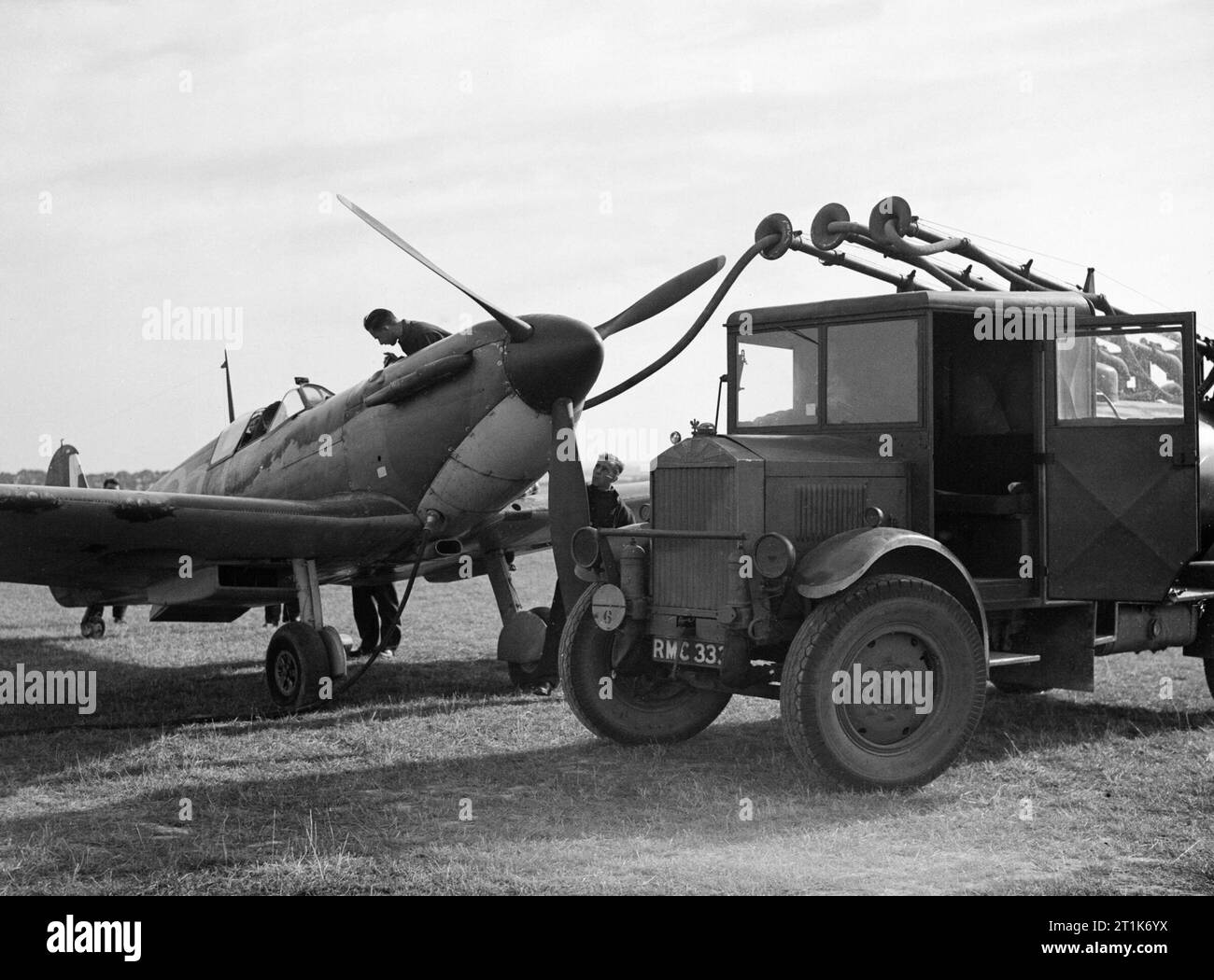 A Spitfire of No. 19 Squadron is refuelled at Fowlmere, near Duxford ...