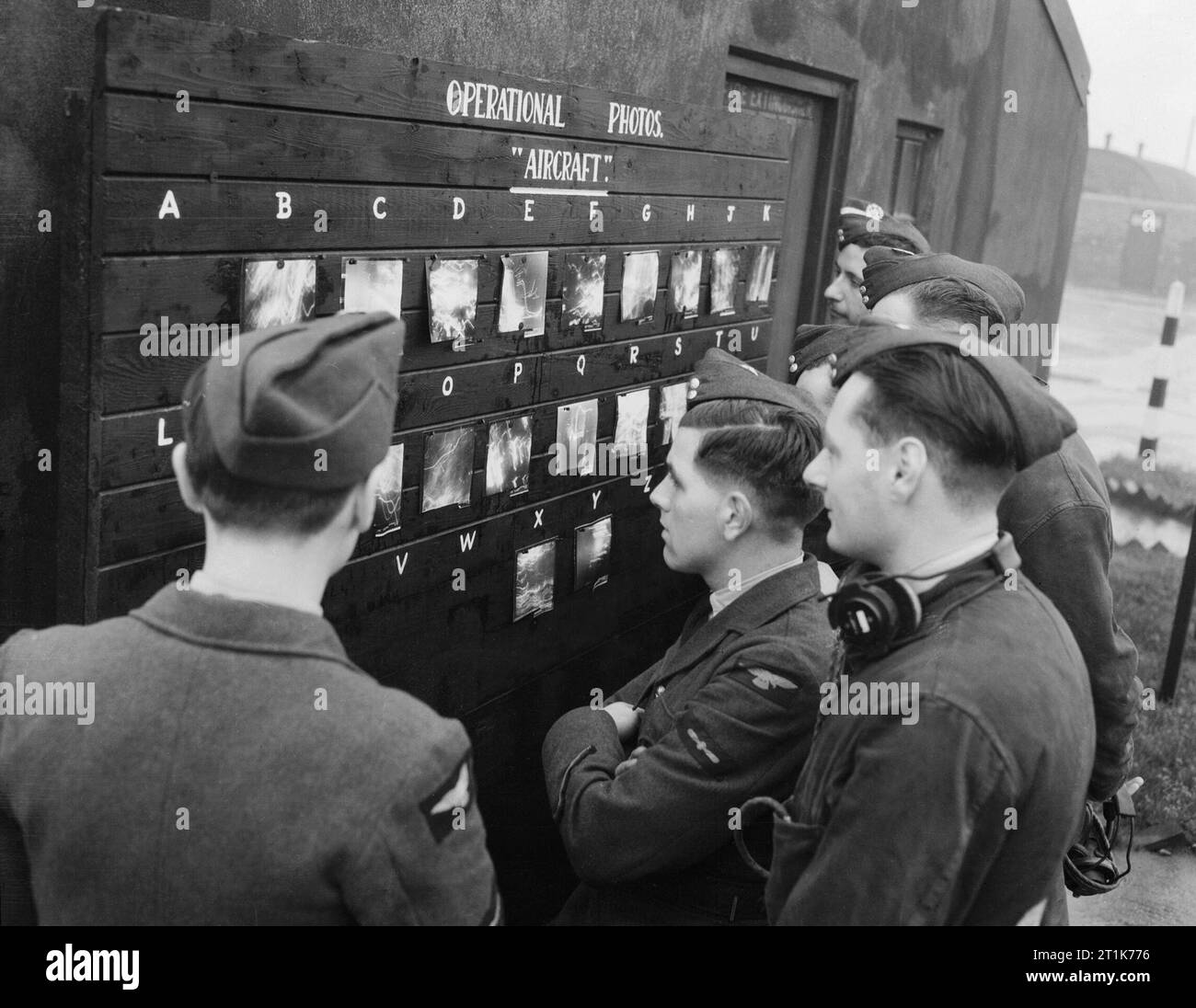 RAF personnel on a bomber station in Britain view a display of target ...