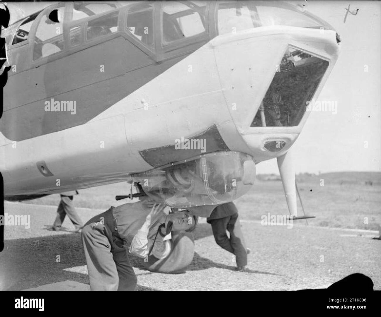 Royal Air Force Bomber Command, 1939-1941. An armourer attends to the ...