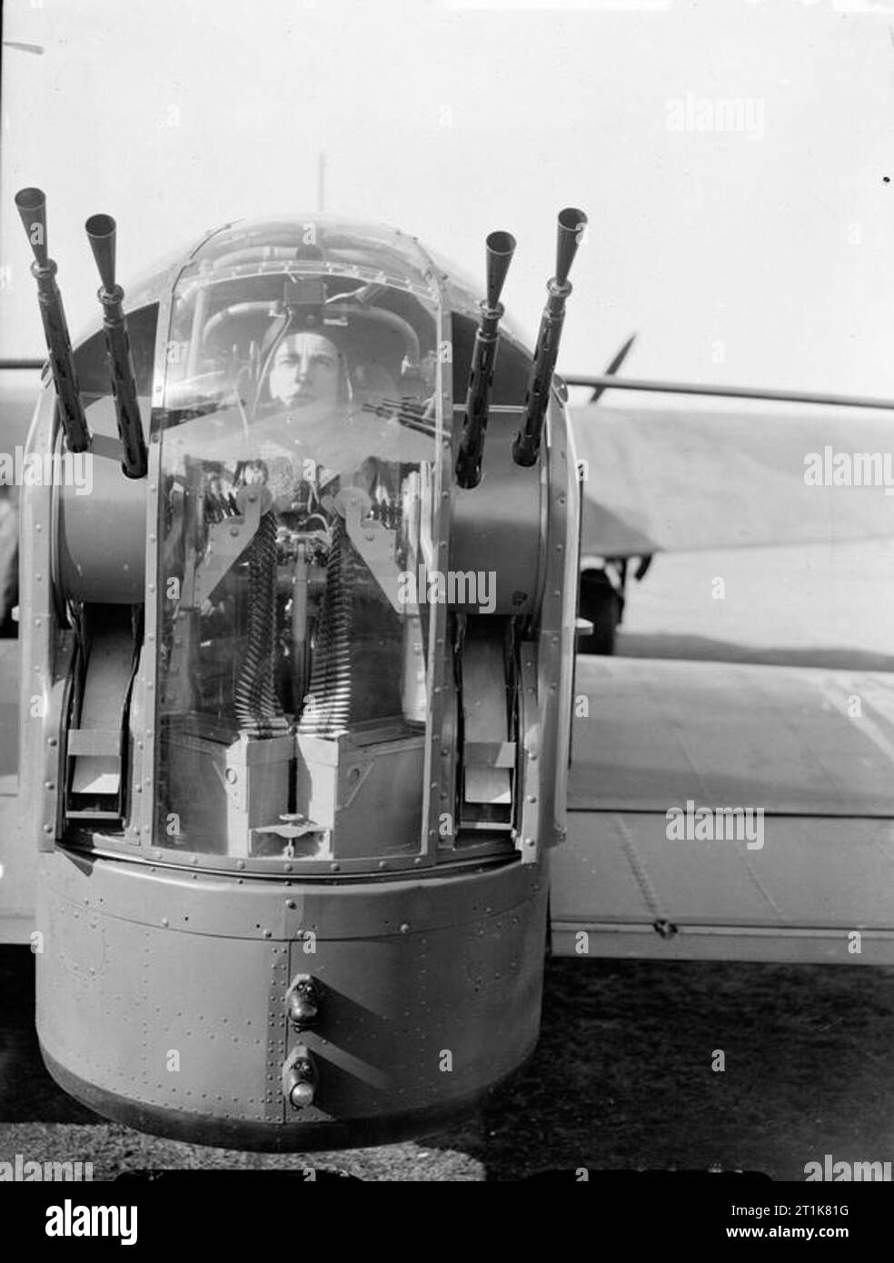 Royal Air Force Bomber Command, 1939-1940. An air gunner sits at the ...