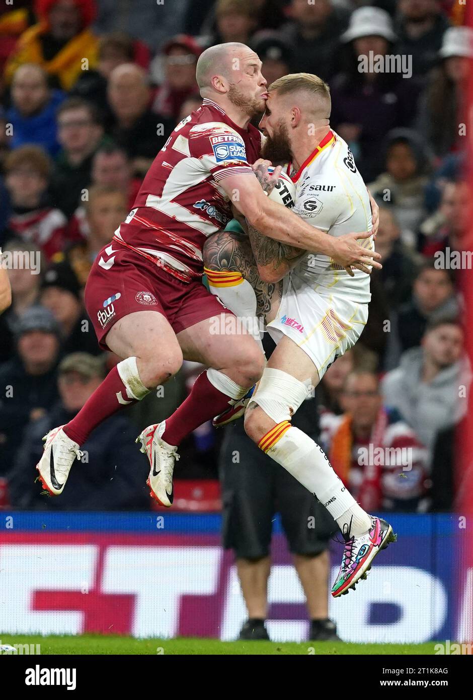 Wigan Warriors' Liam Marshall (centre) and Catalans Dragons' Sam ...