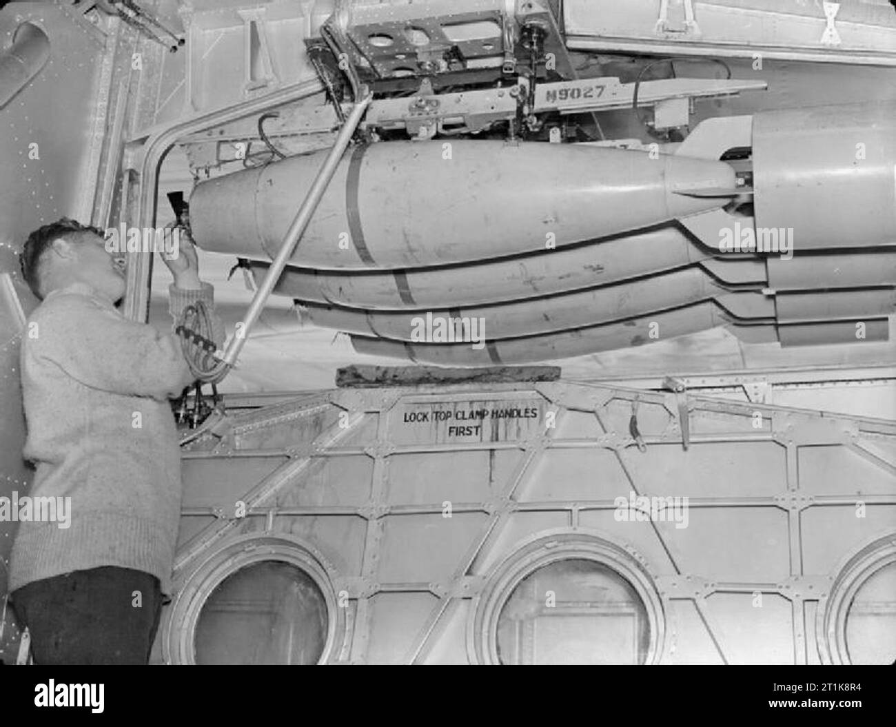 Royal Air Force Coastal Command, 1939-1945. A crew member checks a rack ...