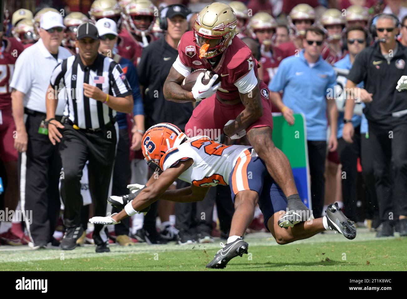 Florida State tight end Jaheim Bell (6) leaps over Syracuse defensive ...