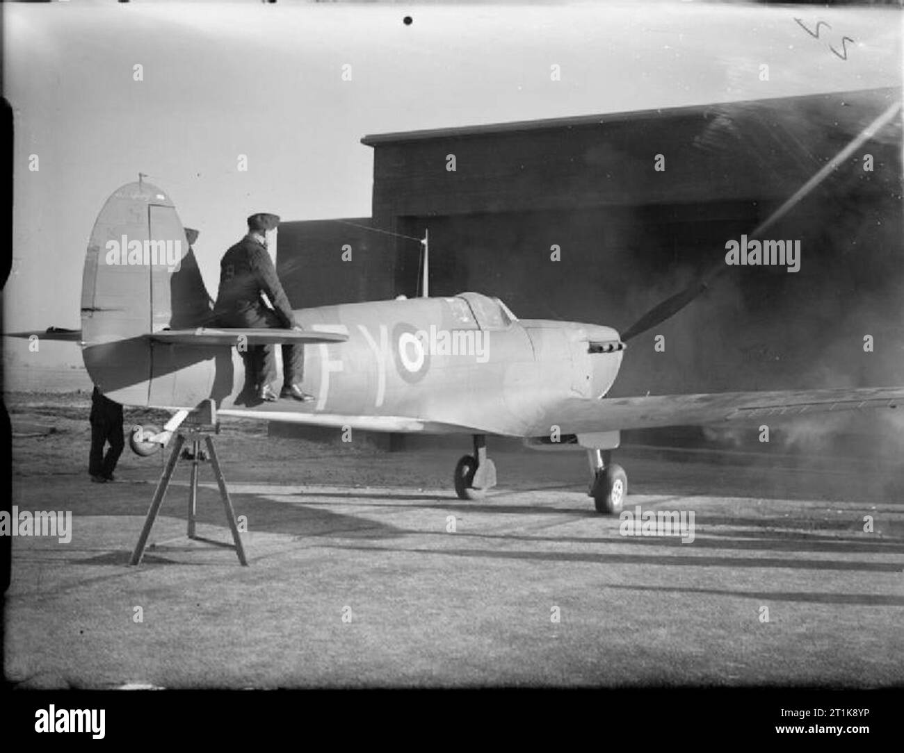 Royal Air Force Fighter Command, 1939-1945. Airmen holding down the tail of a Supermarine ...