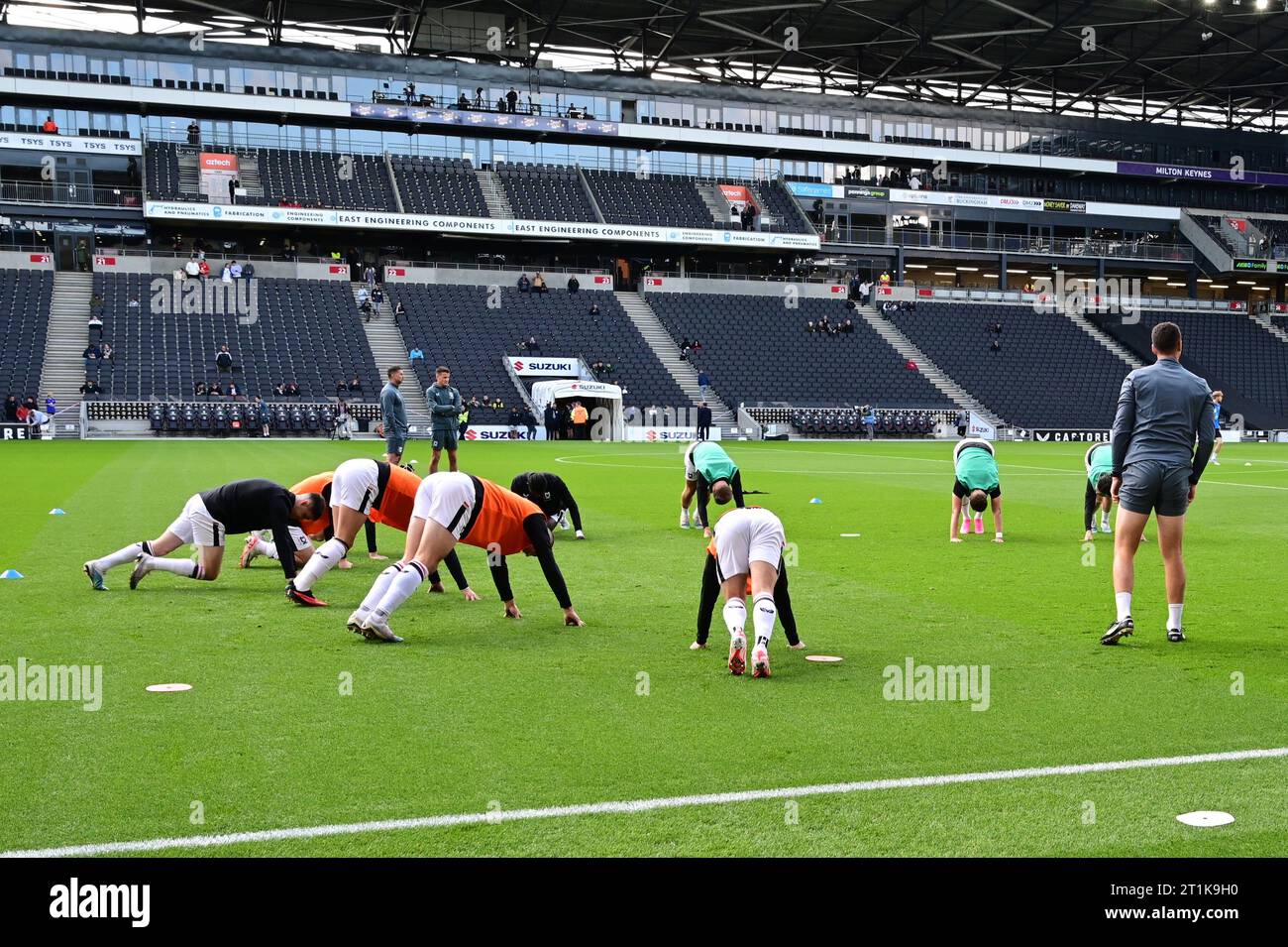 MK Dons football team warming up before the game on the 14th October ...