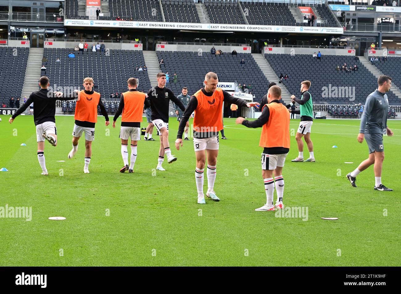 MK Dons football team warming up before the game on the 14th October ...