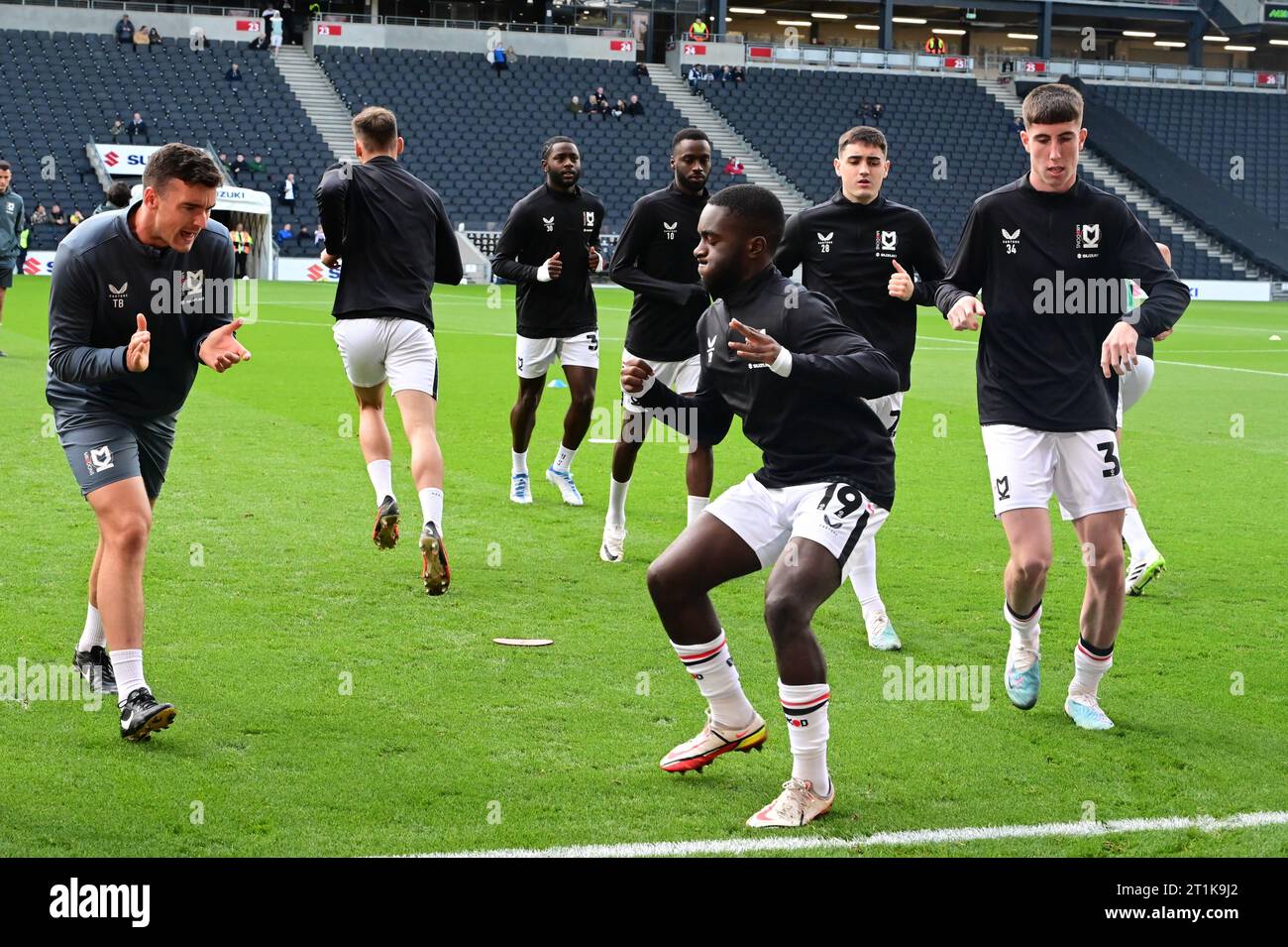 MK Dons football team warming up before the game on the 14th October ...