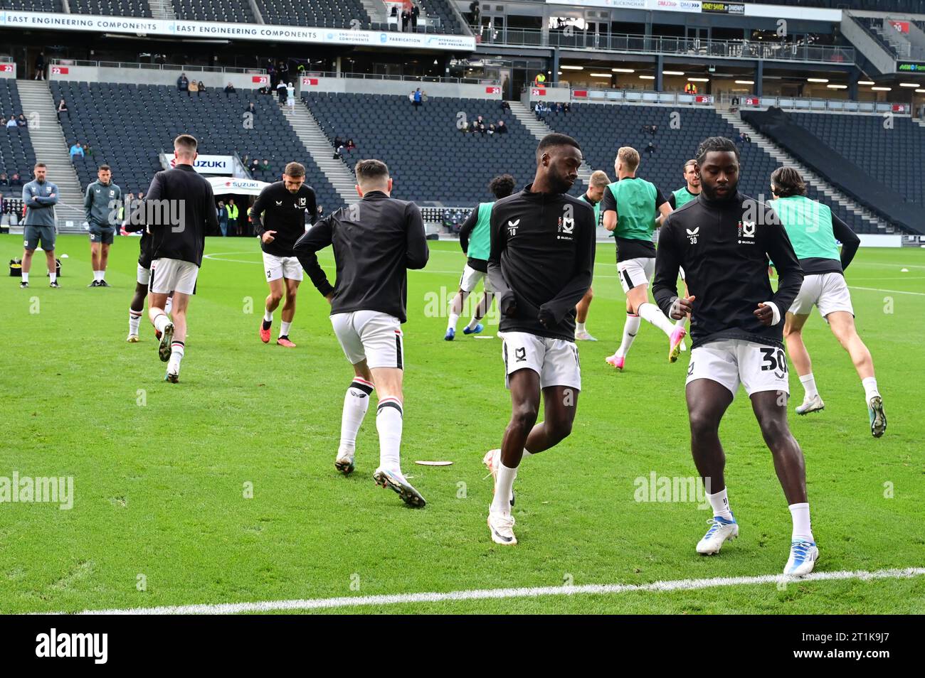 MK Dons football team warming up before the game on the 14th October ...