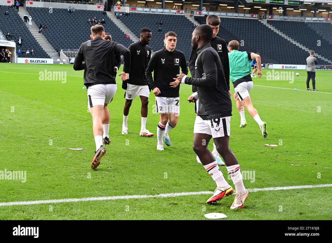 MK Dons football team warming up before the game on the 14th October ...