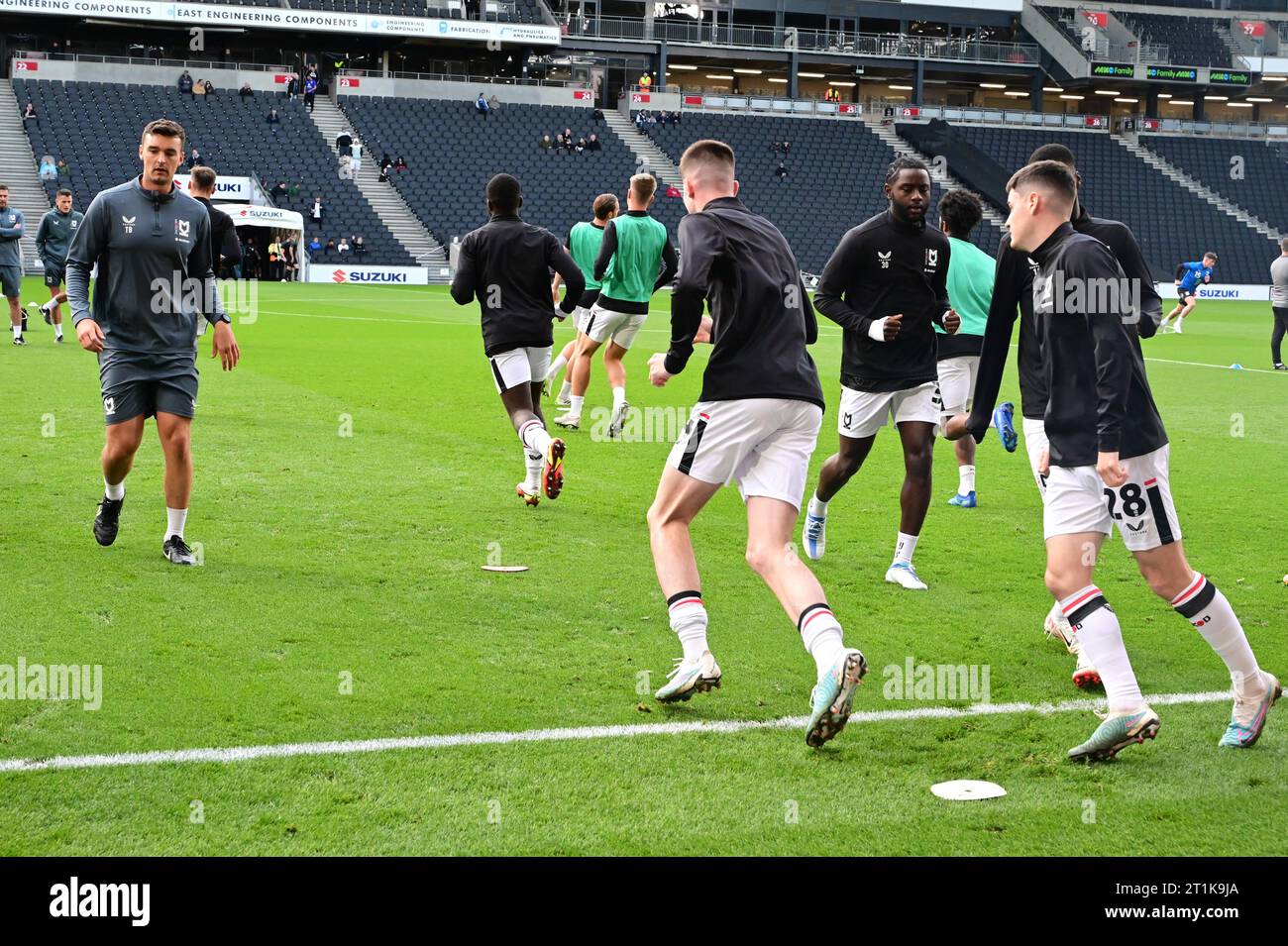 MK Dons football team warming up before the game on the 14th October ...