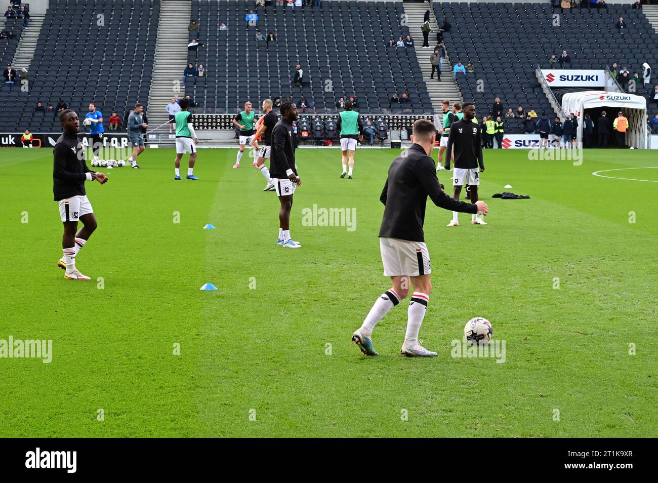 MK Dons football team warming up before the game on the 14th October ...