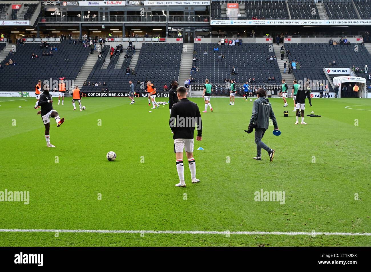 MK Dons football team warming up before the game on the 14th October ...