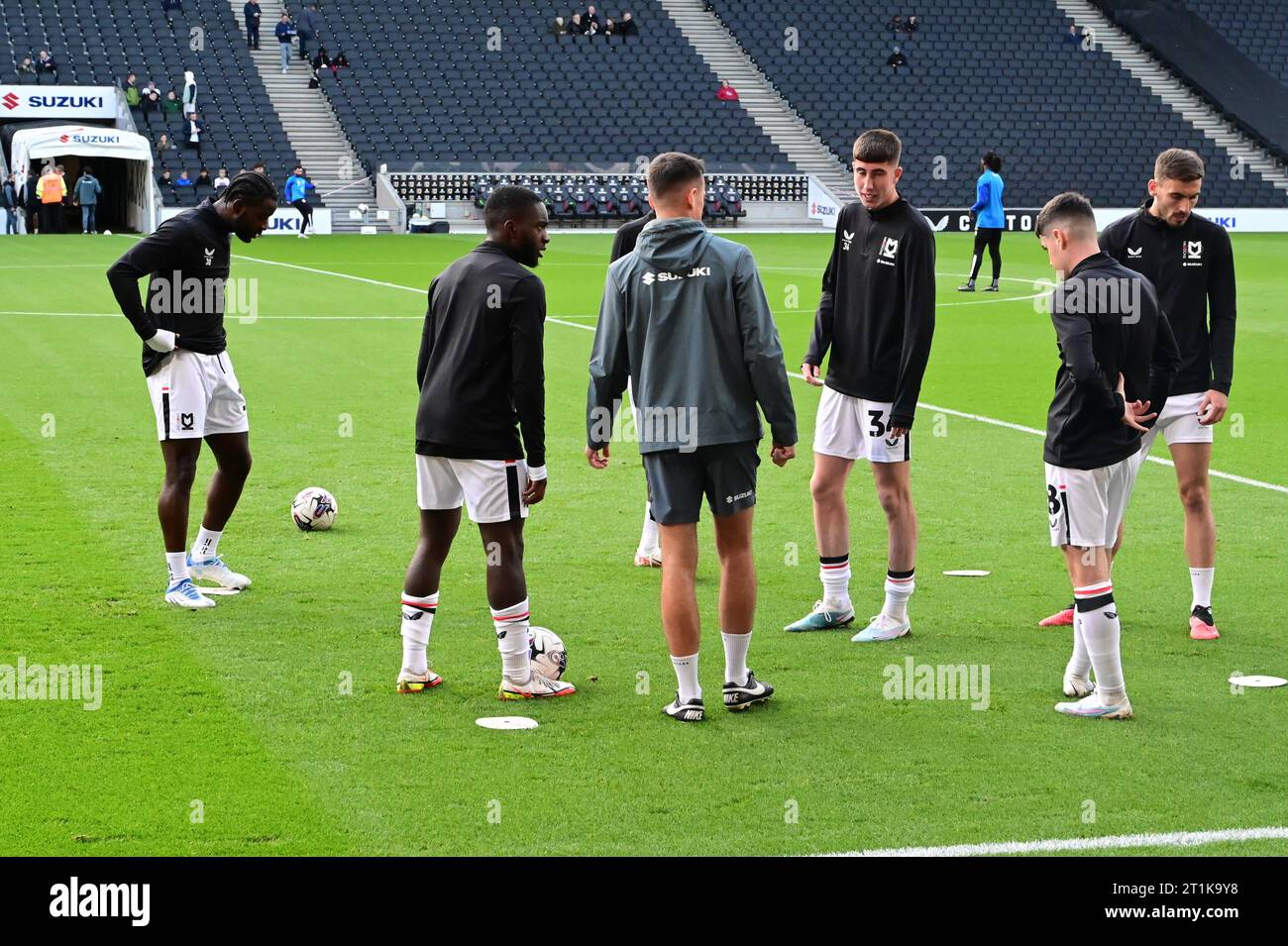 MK Dons football team warming up before the game on the 14th October ...