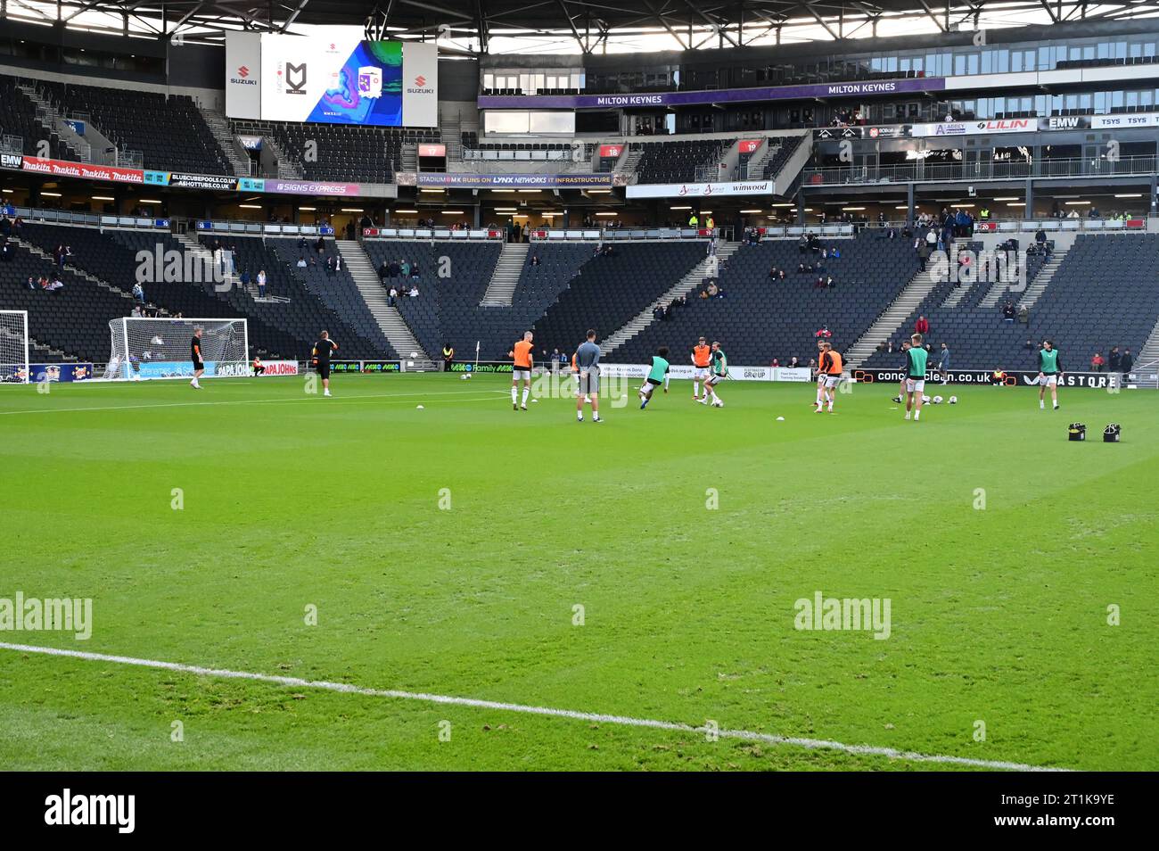 MK Dons football team warming up before the game on the 14th October ...