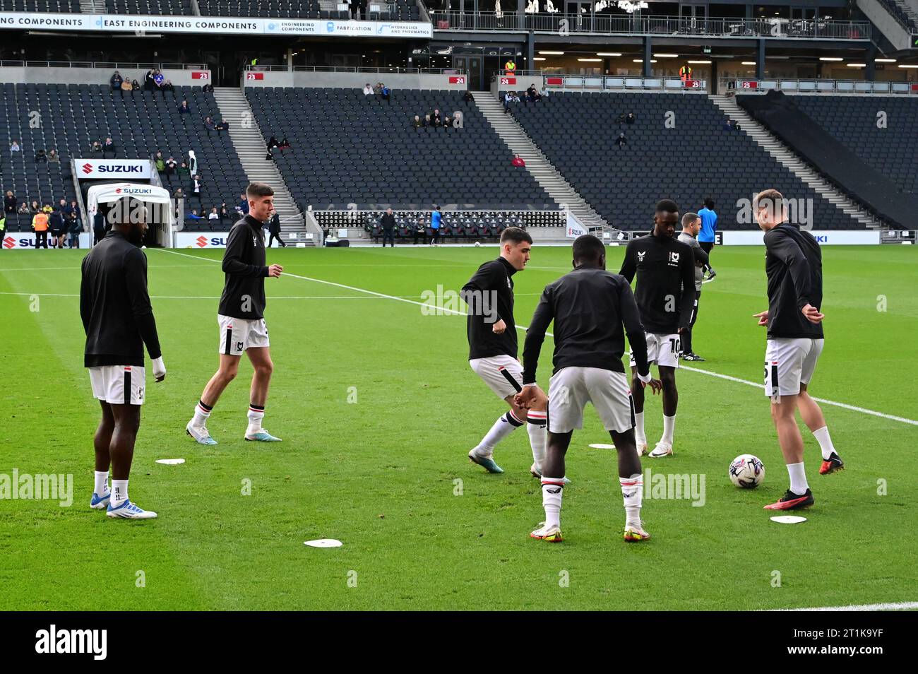 MK Dons football team warming up before the game on the 14th October ...