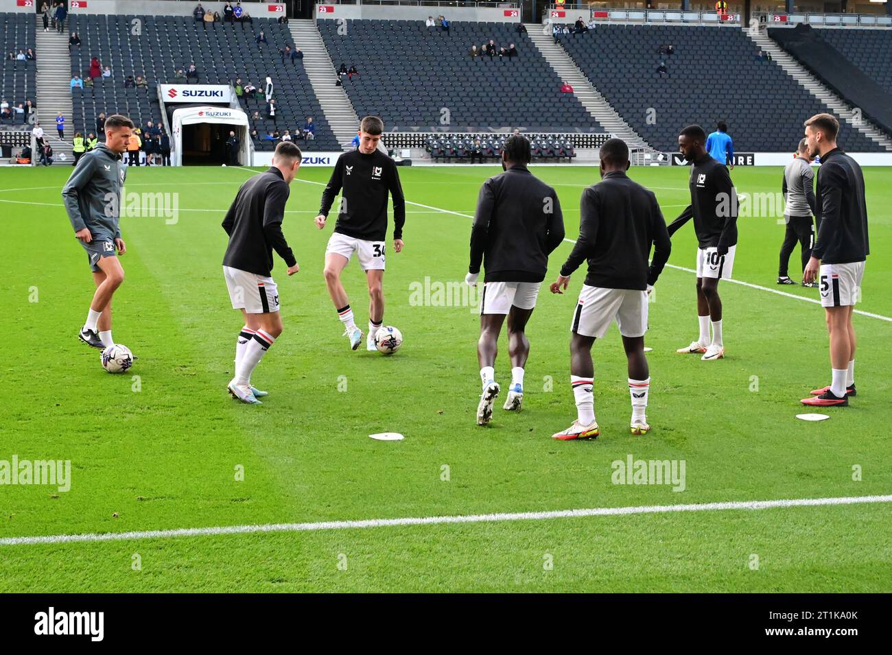 MK Dons football team warming up before the game on the 14th October ...
