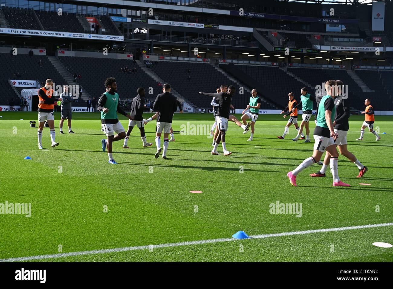 MK Dons football team warming up before the game on the 14th October ...