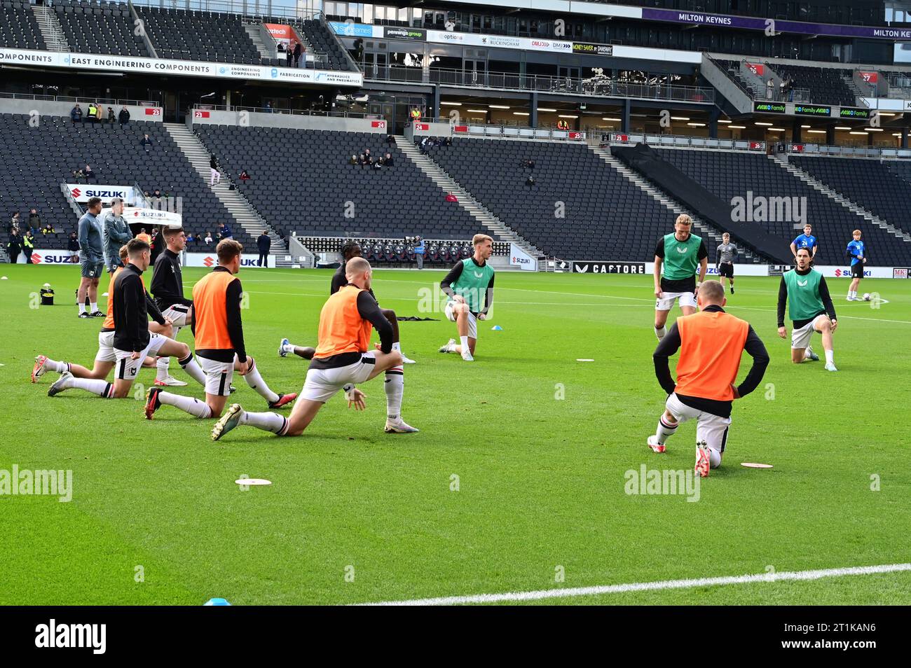 MK Dons football team warming up before the game on the 14th October ...