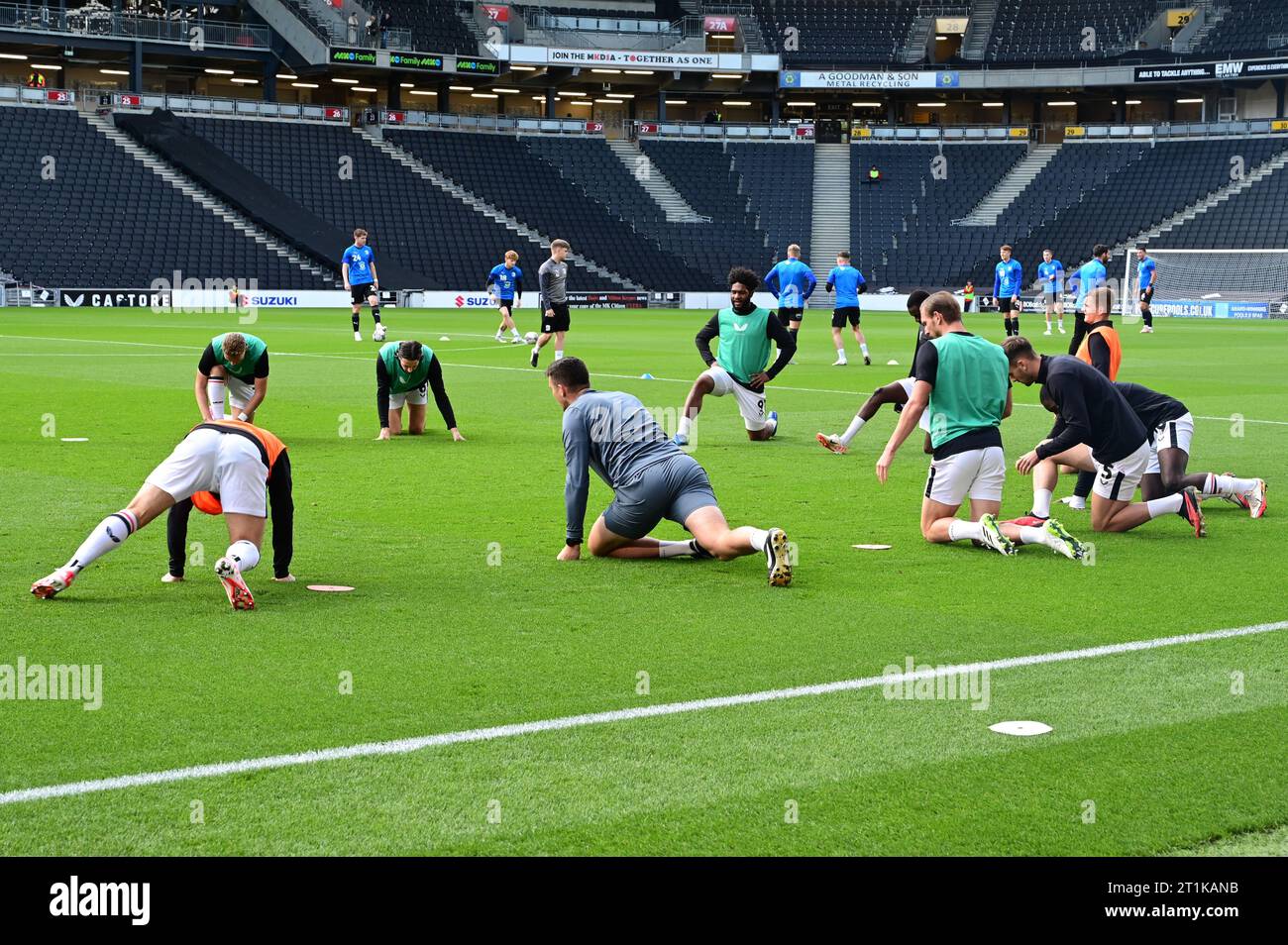 MK Dons football team warming up before the game on the 14th October ...