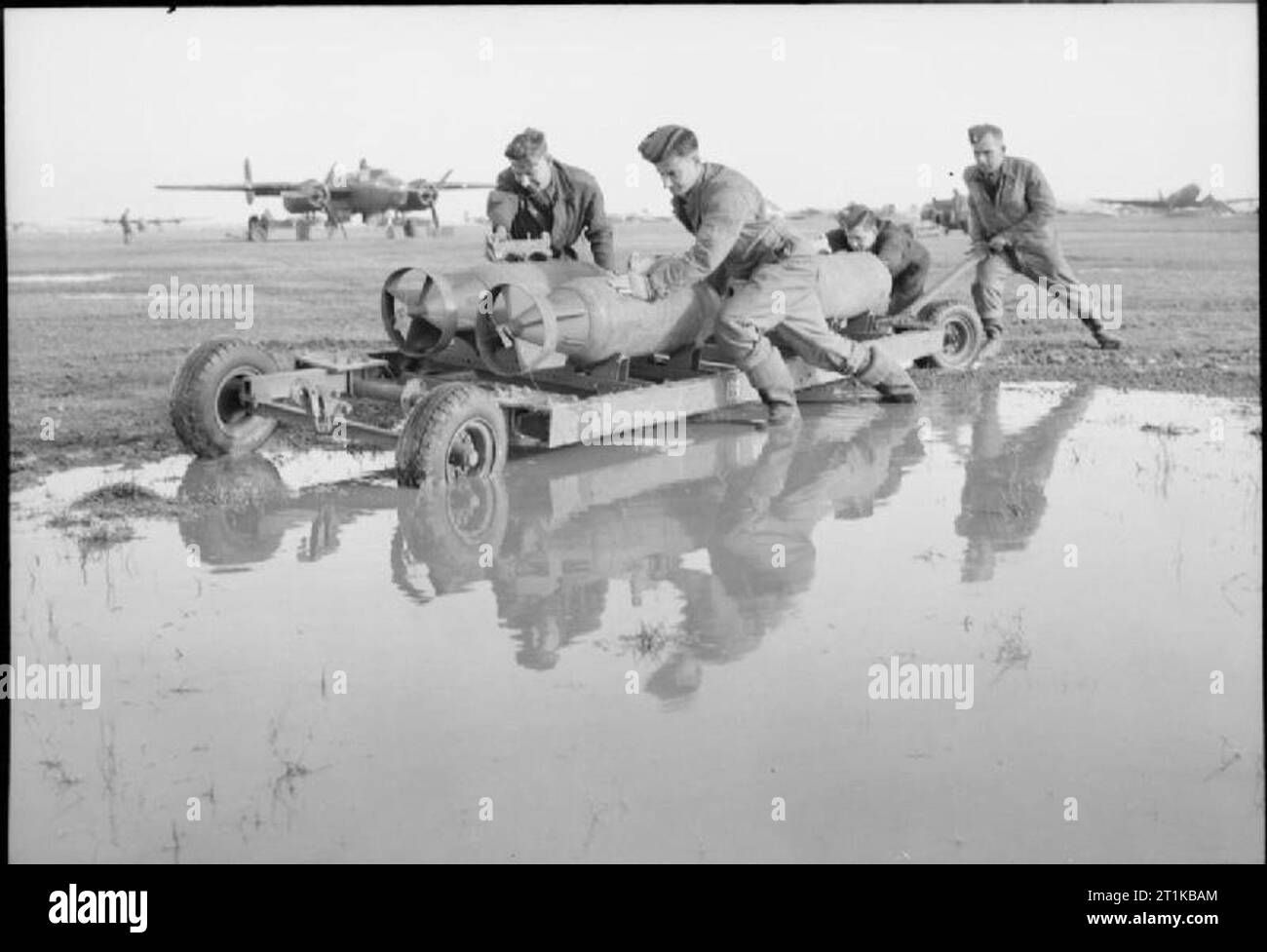 Royal Air Force- 2nd Tactical Air Force, 1943-1945. Armourers push a ...