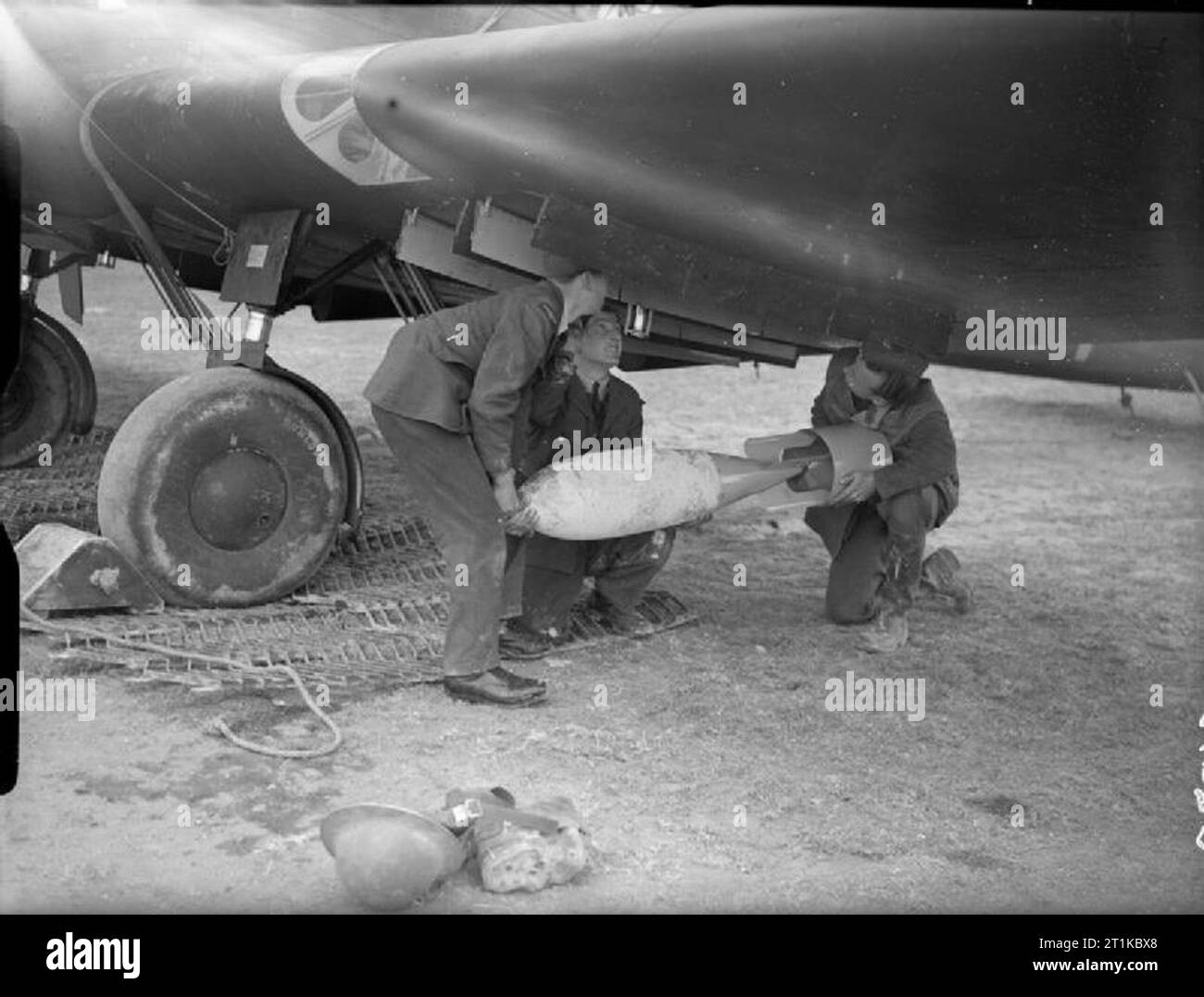 Royal Air Force- France, 1939-1940. Armourers load a 250-lb GP bomb ...