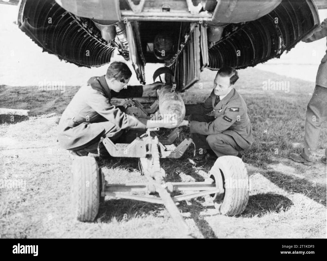 Royal Air Force Bomber Command, 1939-1941. Armourers load a 250-lb GP ...