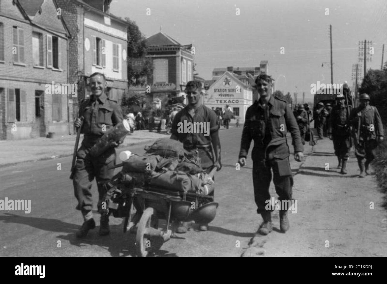 The British Army in France 1940 Troops use a wheelbarrow to carry their ...