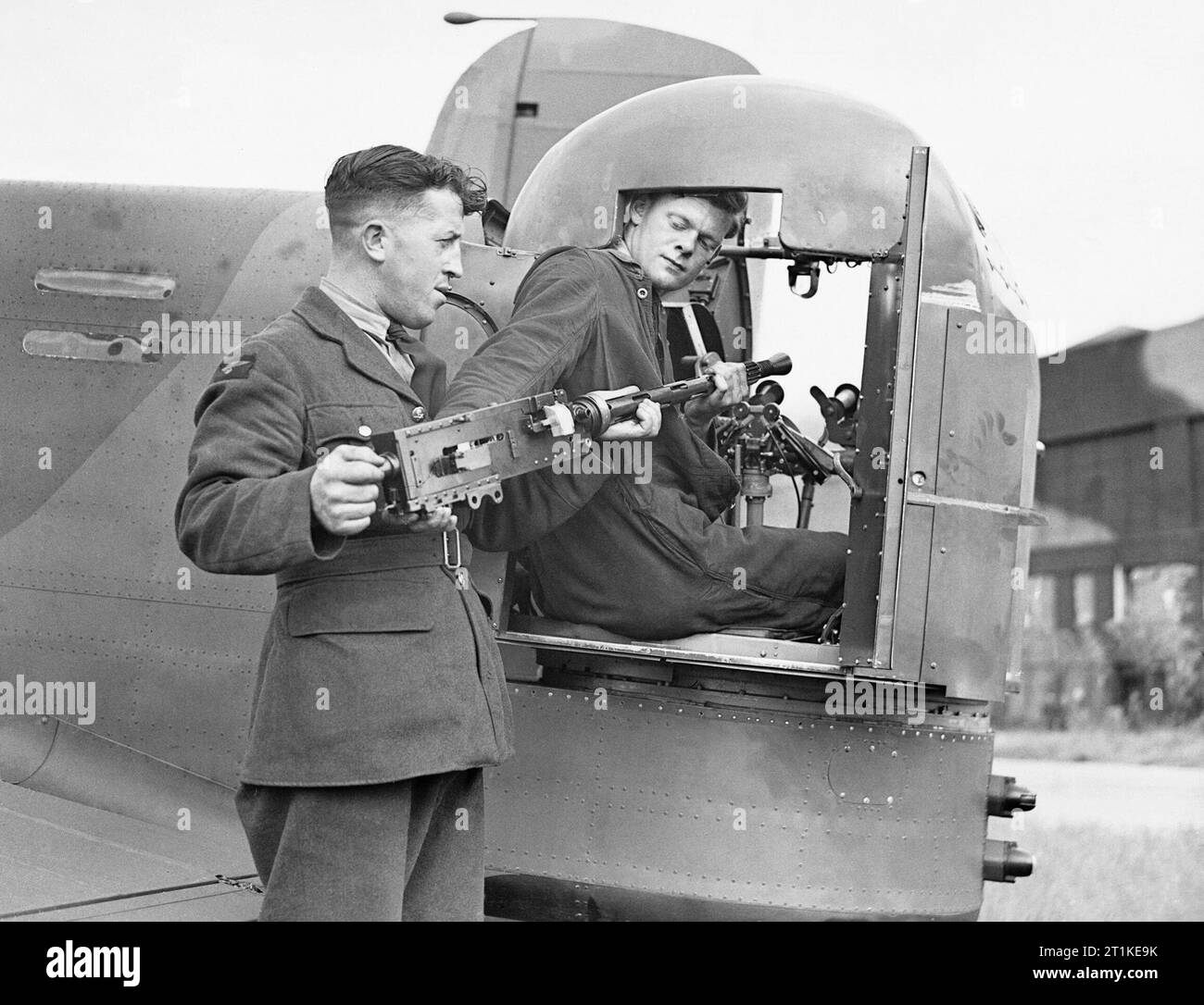 Armourers install .303 Browning machine guns into the rear turret an ...