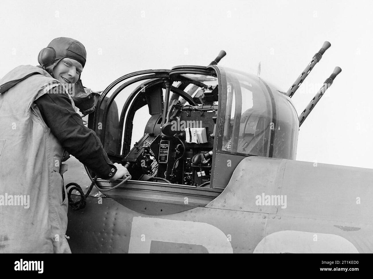 An air gunner of No. 264 Squadron RAF about to enter the gun turret of ...