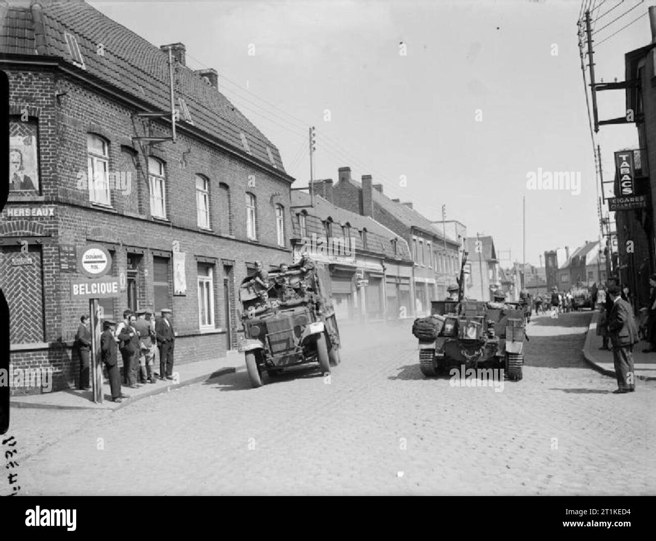The British Army in France and Belgium 1940 Carriers and trucks move ...