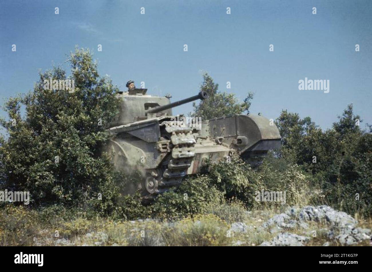 A Churchill tank of 51st Royal Tank Regiment, moving through the ...