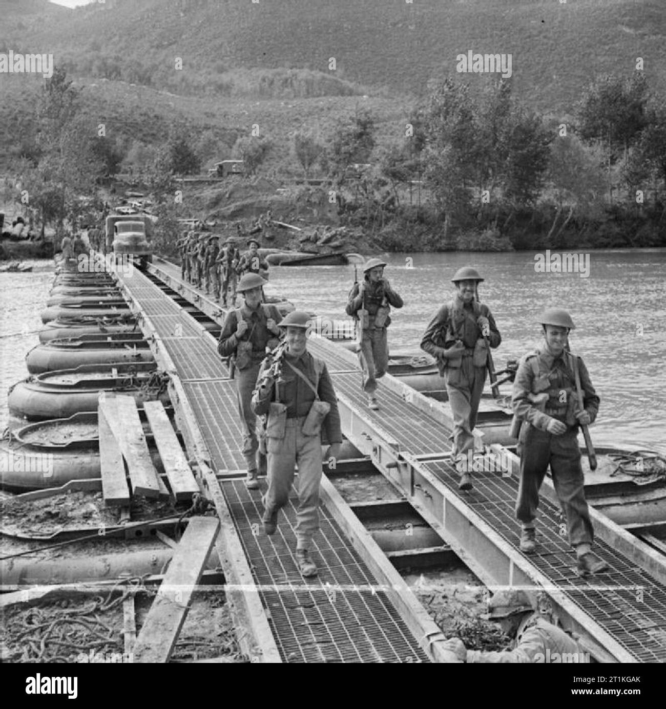 The British Army in Italy 1943 Troops crossing a pontoon bridge over ...