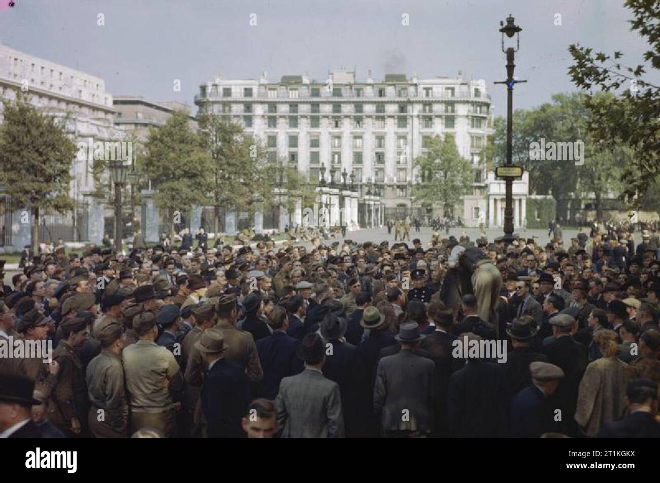 The Home Front in Britain, 1944 A crowd of civilians and servicemen ...