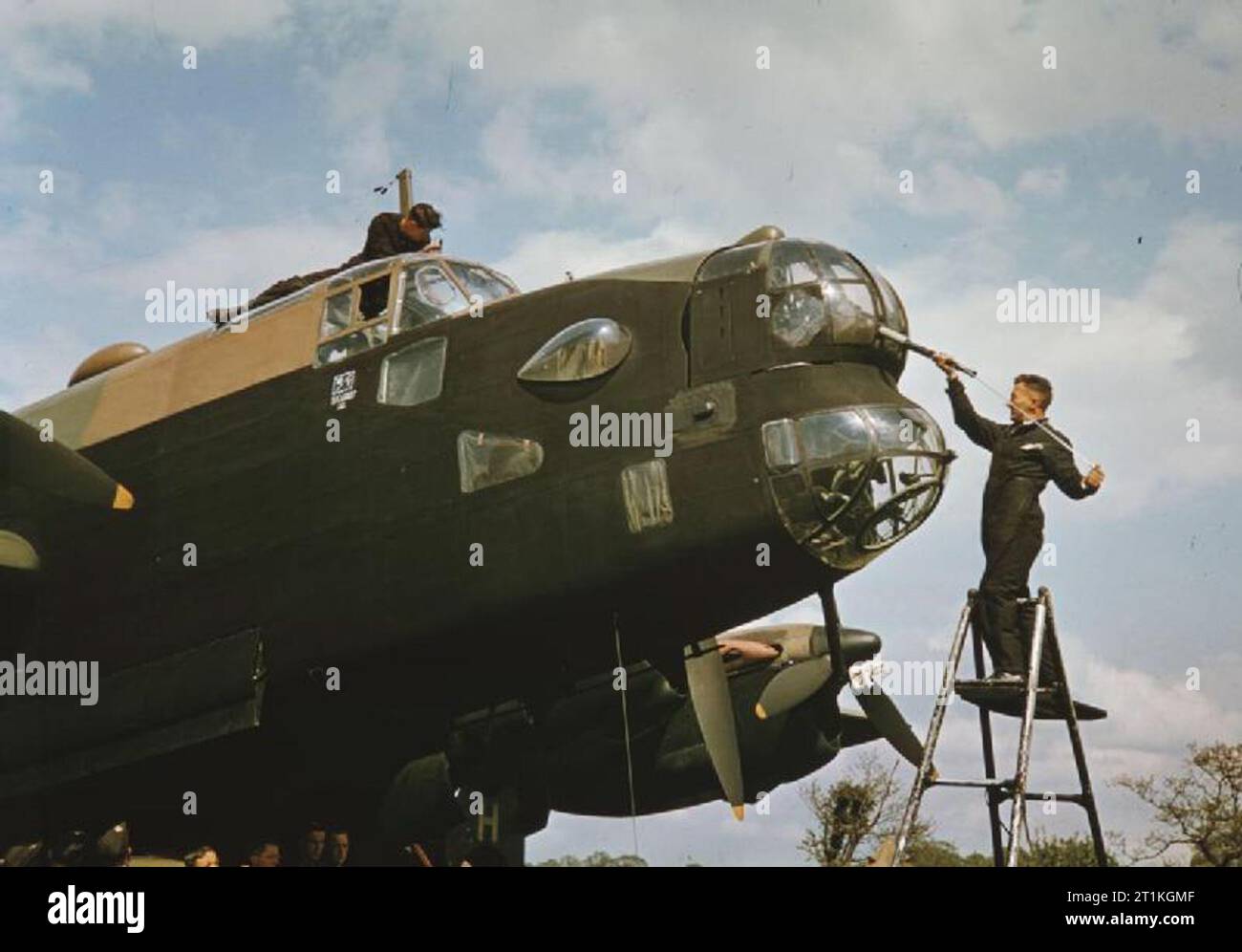 The Royal Air Force in Britain, 1942 A rigger cleans the cockpit ...