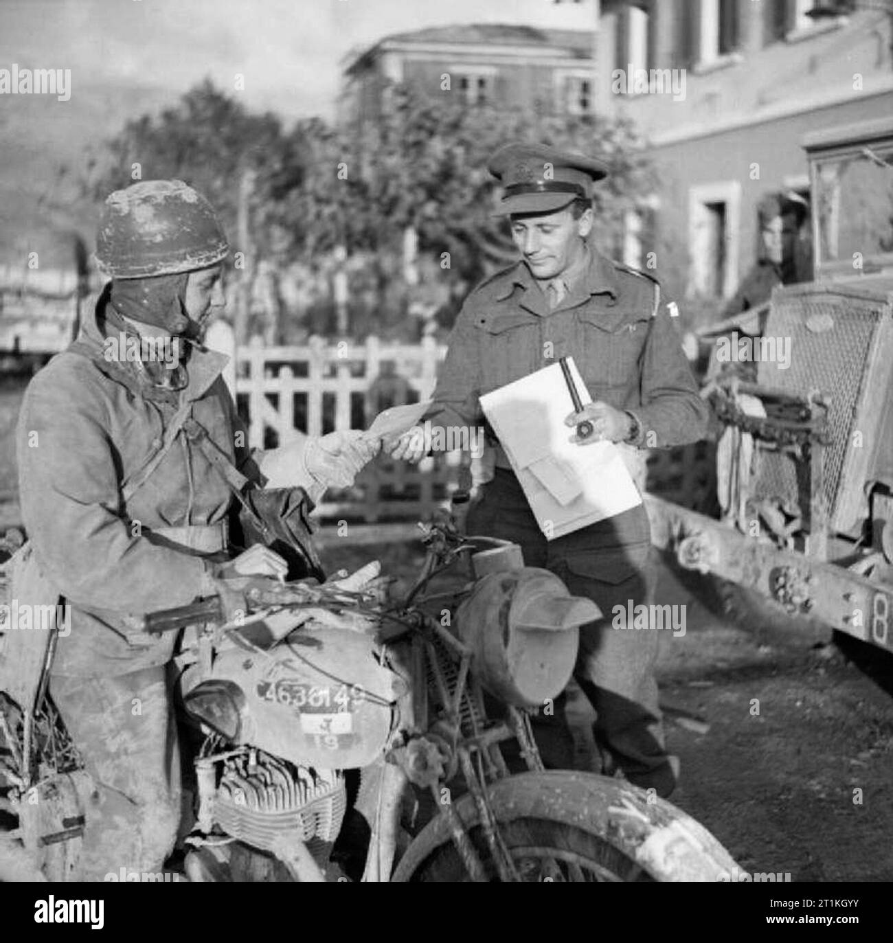 The British Army in Italy 1943 A motorcycle despatch rider hands a ...