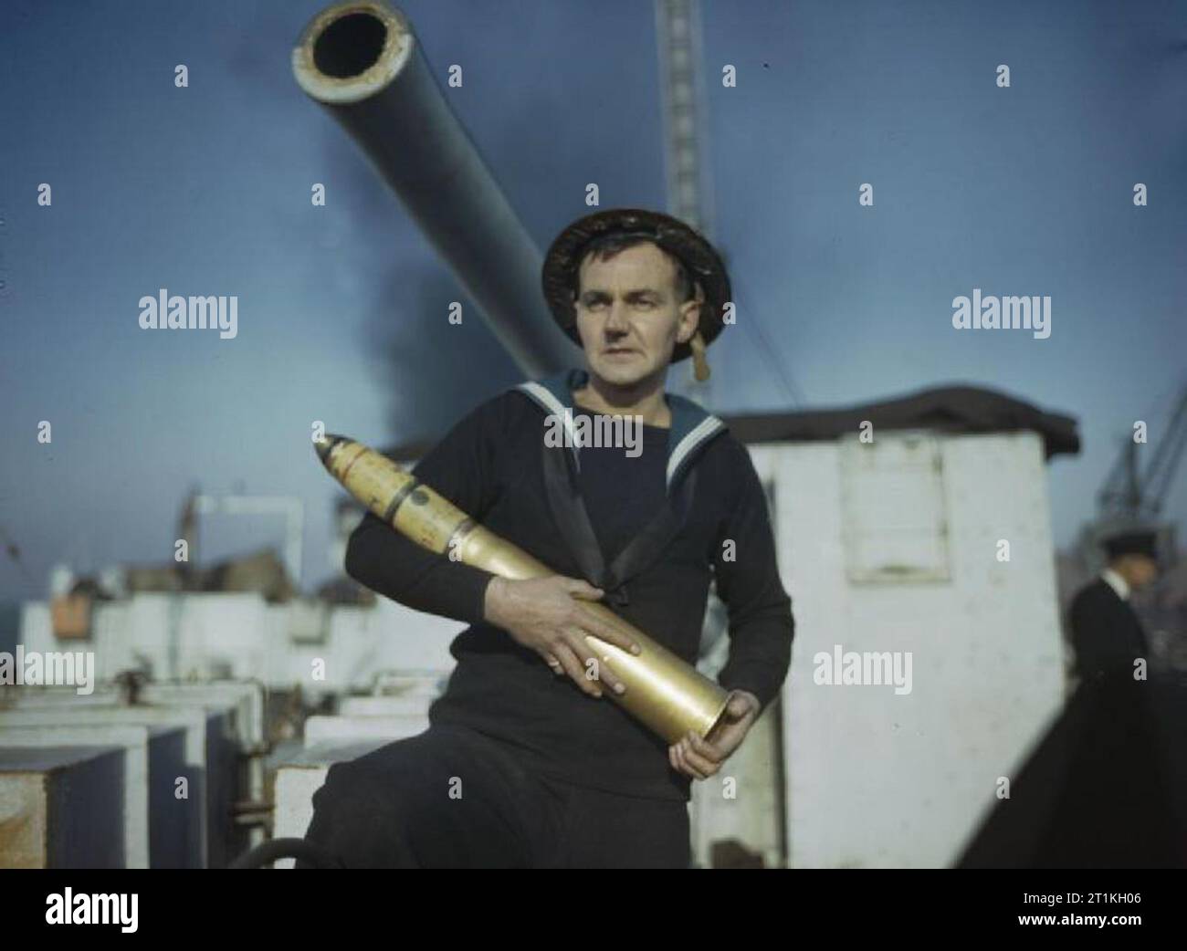 The Royal Navy, November 1943 A naval gunner holding a shell Stock ...