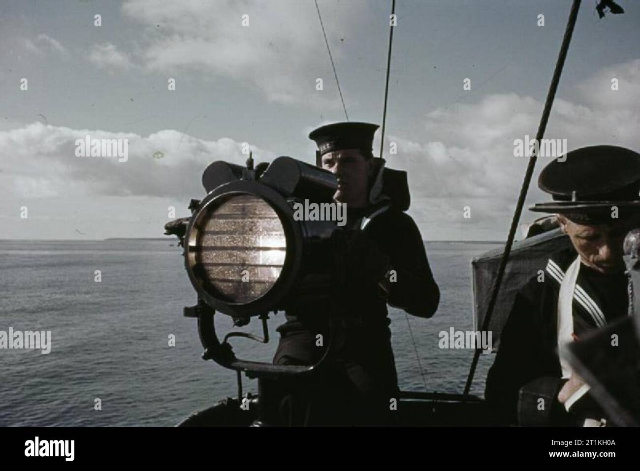 The Royal Navy in 1942 A signaller operating an Aldis lamp on board a ...