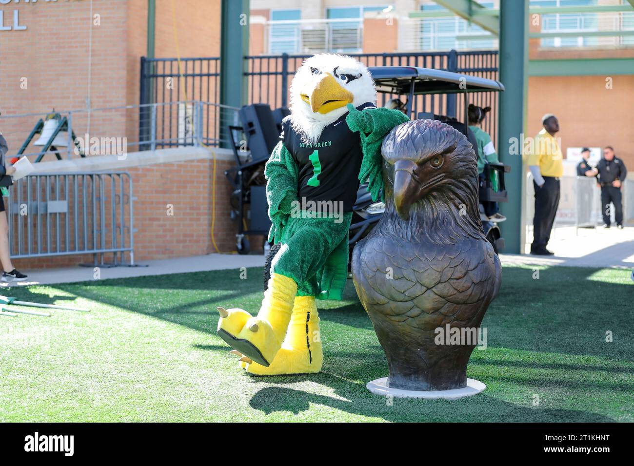October 14, 2023:.North Texas Mascot poses with the bronze statue ...