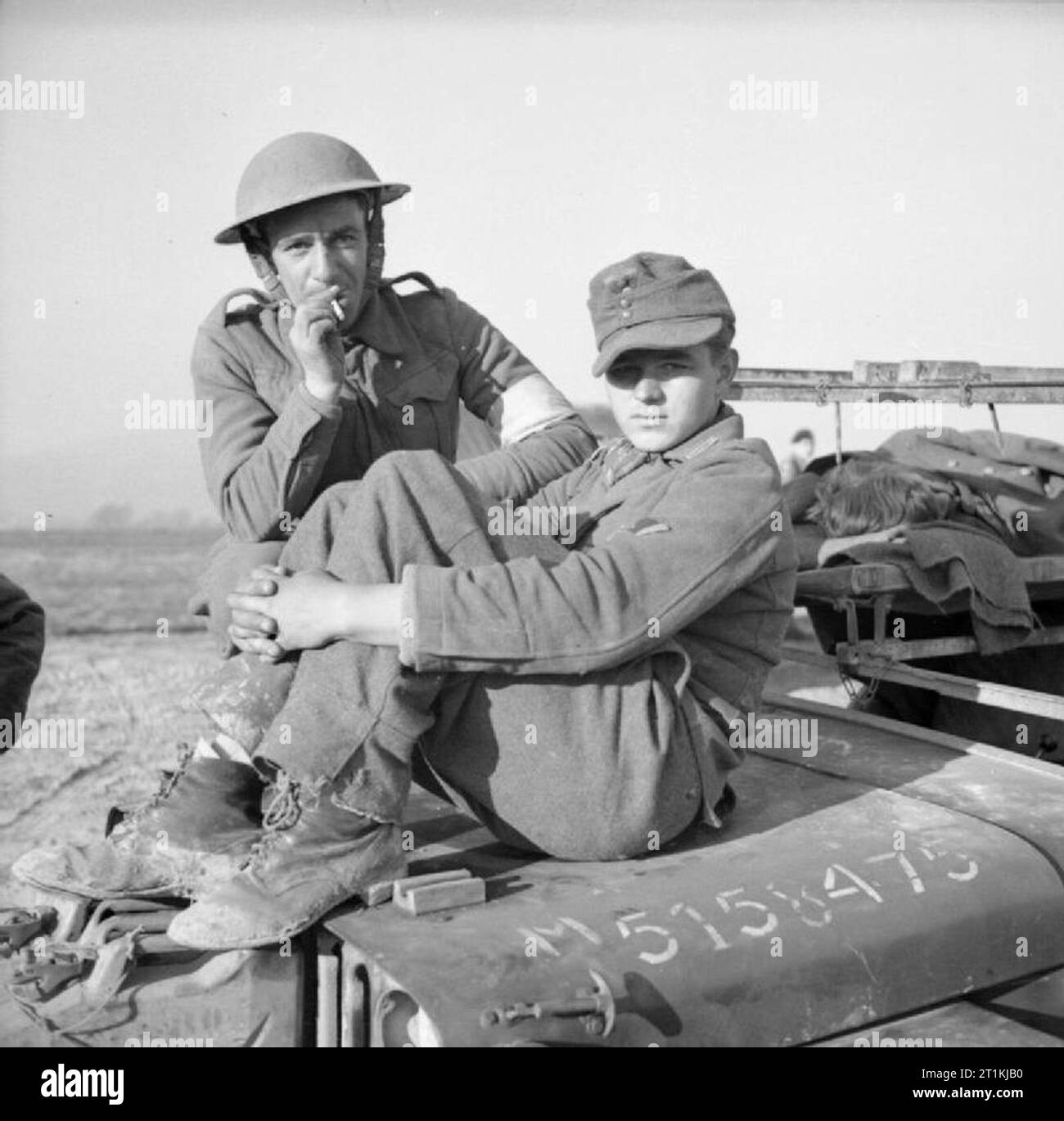 The British Army in Italy 1944 A British soldier with a young German ...