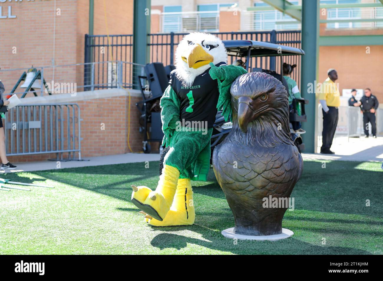 October 14, 2023:.North Texas Mascot poses with the bronze statue ...