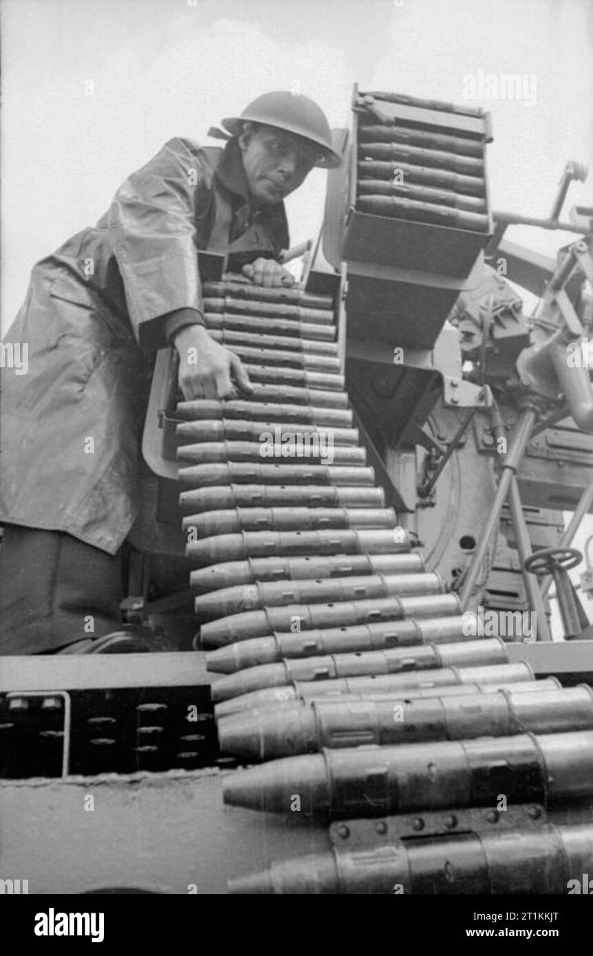 A Visit To An Anti-aircraft Ship, England, 1940 Ammunition is loaded ...