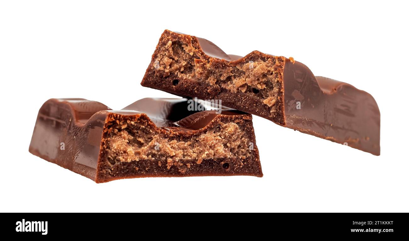 Chocolate bar broken in half on a white background. Chocolate pieces ...