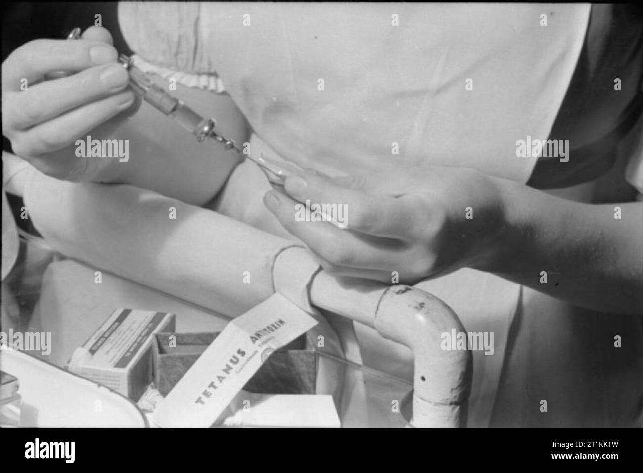 Guy's Hospital- Life in a London Hospital, England, 1941 A nurse loads ...