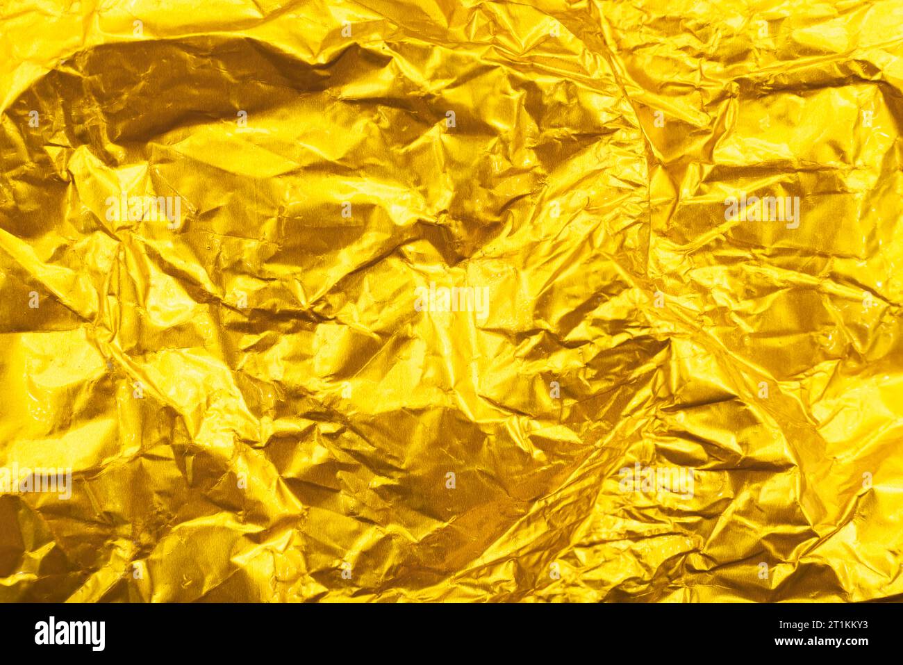 Texture of crumpled yellow foil. Foil with dents, folds and wrinkles ...