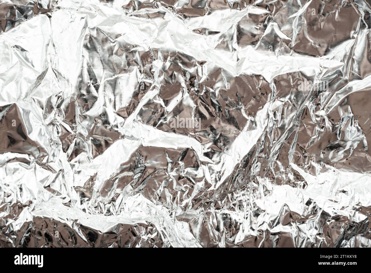 Texture of crumpled silver foil. Foil with dents, folds and wrinkles ...