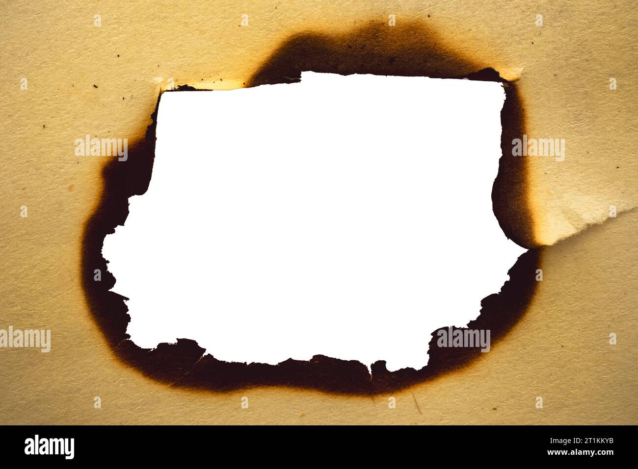 Burnt hole in yellow paper. Burnt paper Stock Photo - Alamy