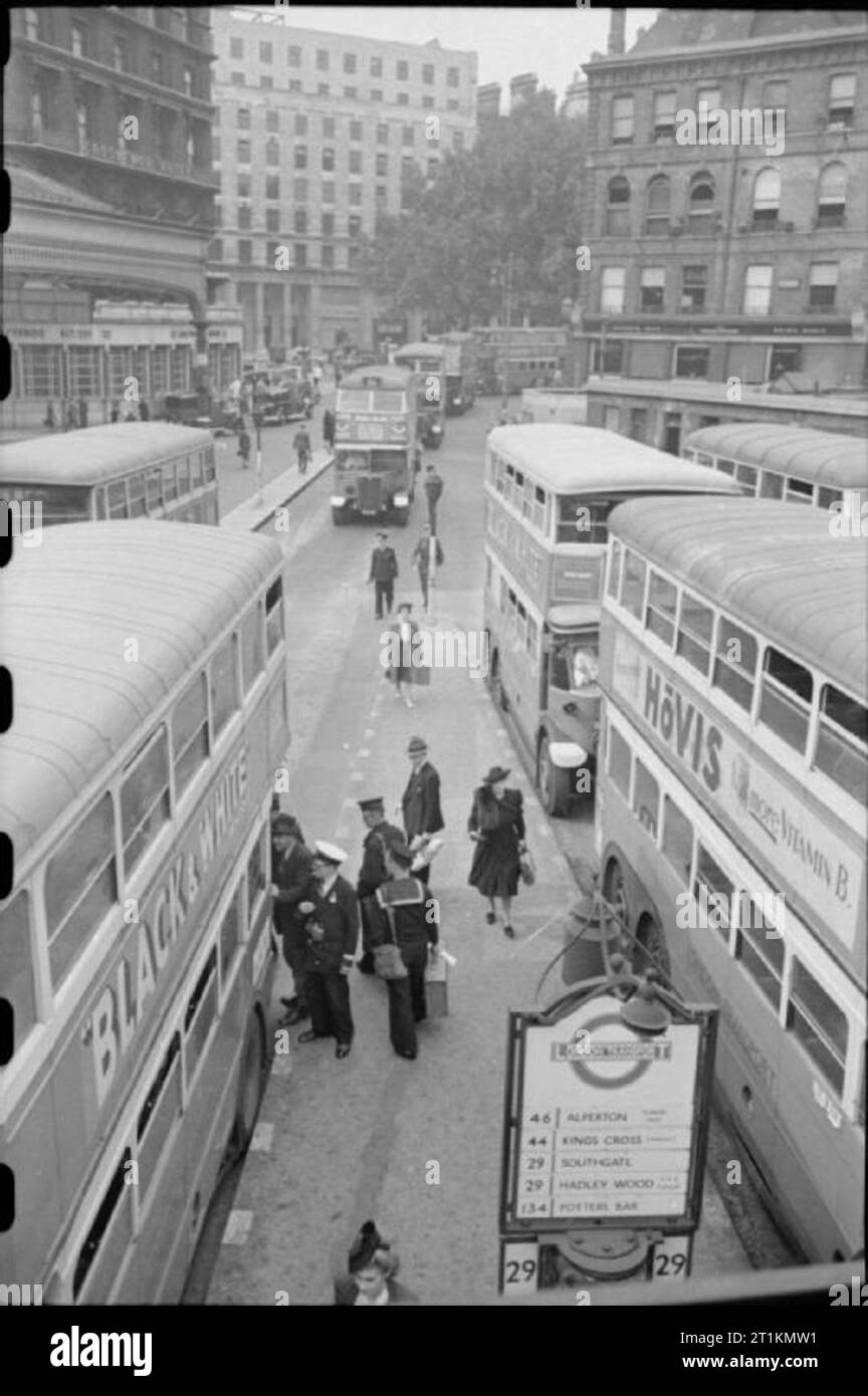 London Buses in Wartime, England, 1941 A busy scene at Victoria bus ...