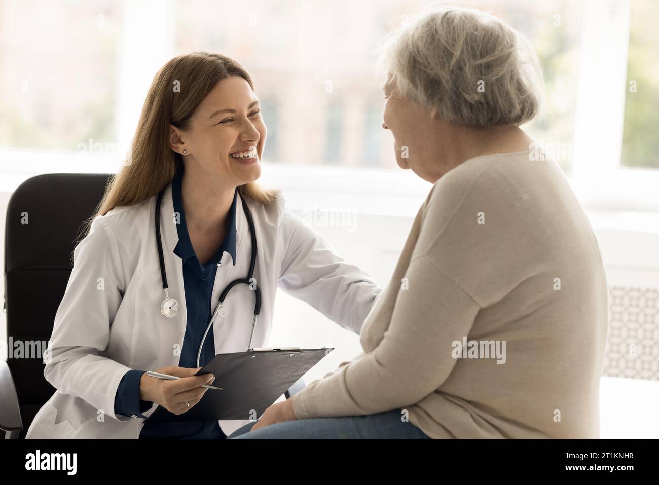 Elderly medical professional talks patient hi-res stock photography and ...